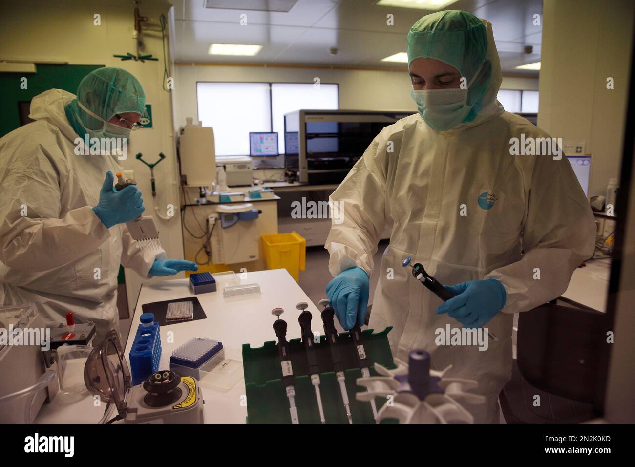 FILE - In this March 30 2015 file photo, forensic scientists of the ...