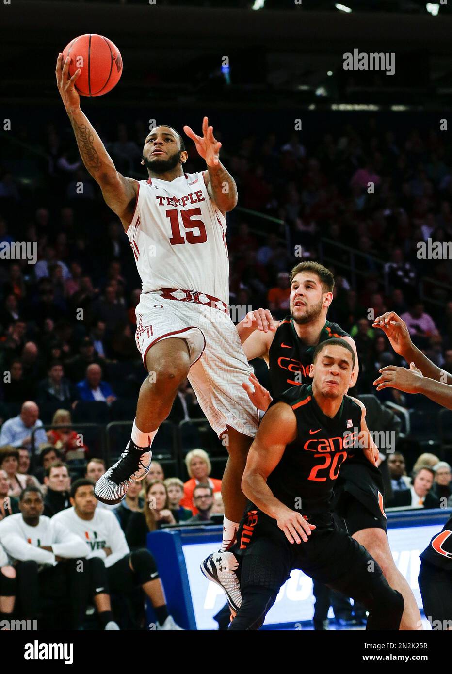 Temple's Jaylen Bond (15) drives past Miami's Manu Lecomte (20) and ...