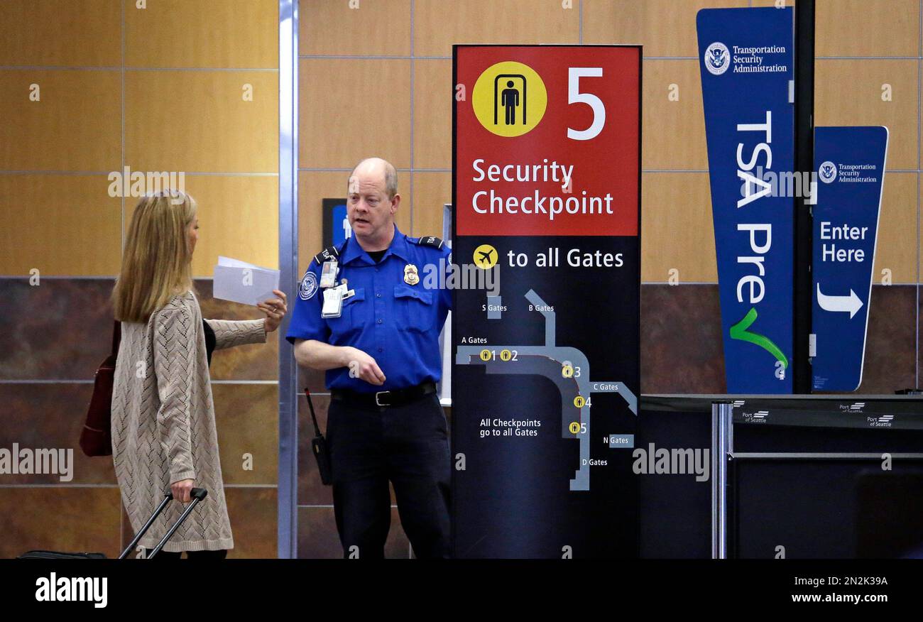 In this photo taken Tuesday, March 24, 2015, a passenger shows a ...