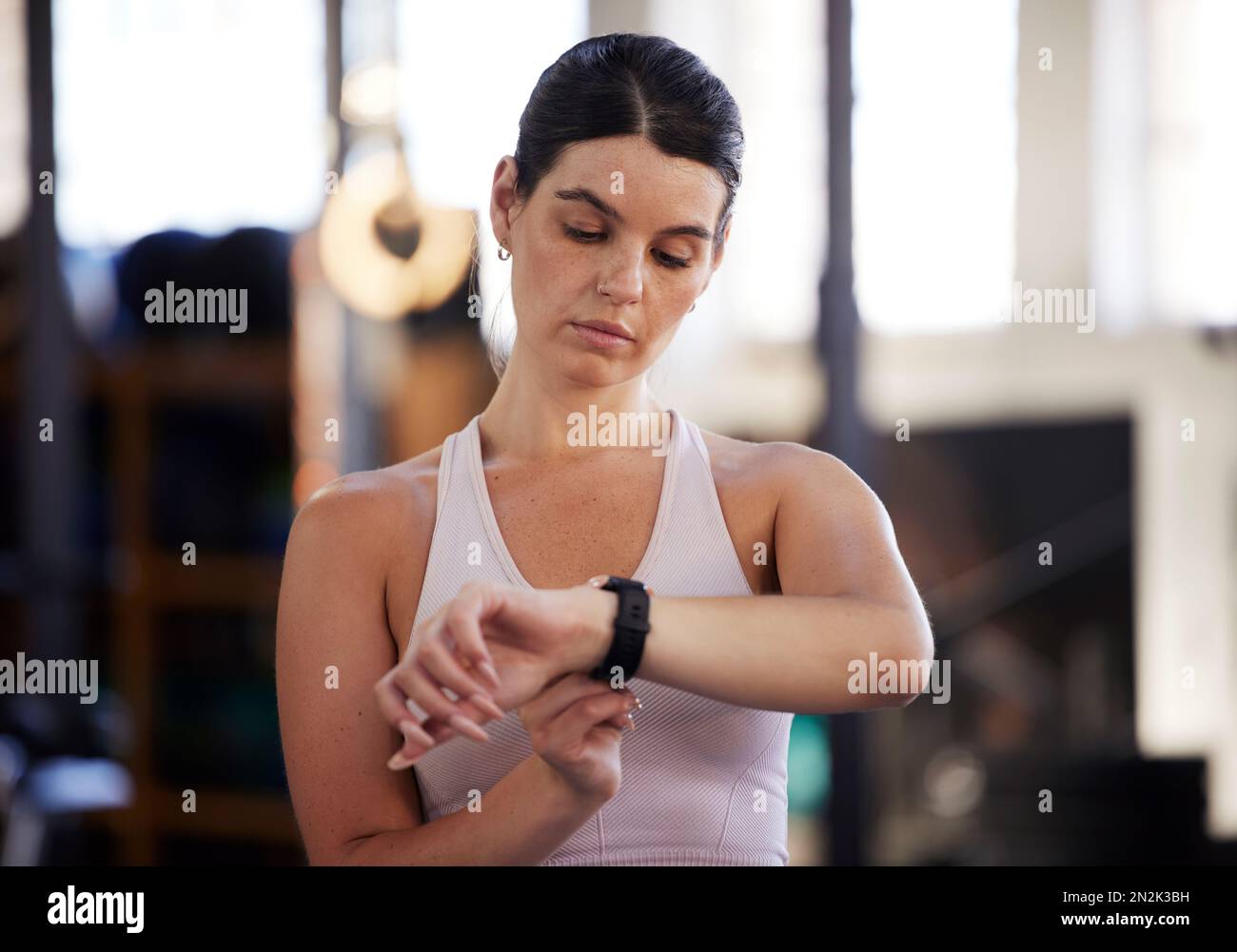 Fitness, smartwatch and woman in gym for training, workout or exercise ...