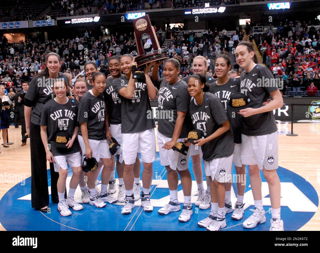 Connecticut players pose with the trophy after their 91-70 win over ...