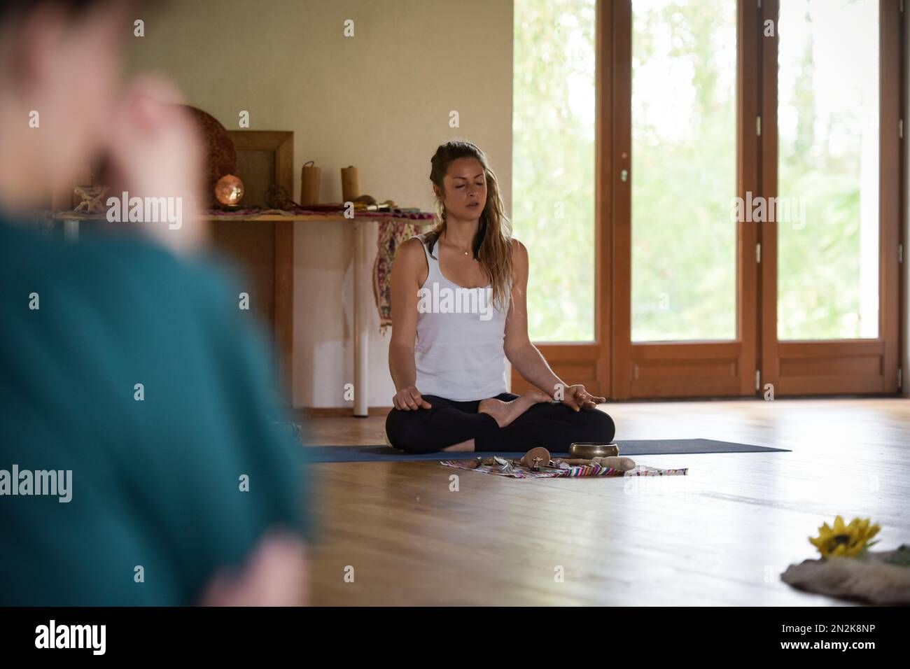 yoga coach during a group session at a retreat Stock Photo - Alamy