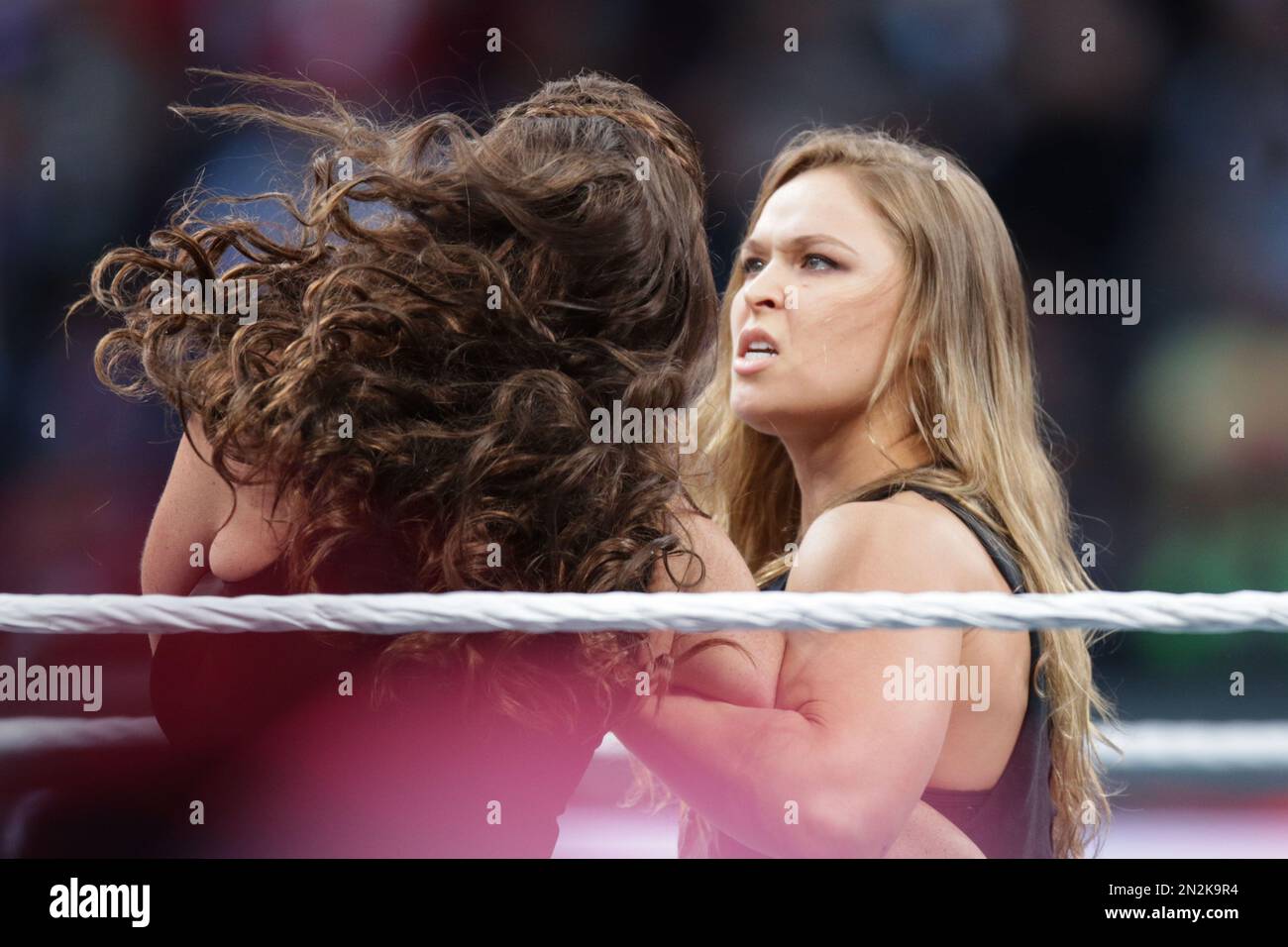 UFC fighter Ronda Rousey makes a surprise appearance at WrestleMania 31 ...