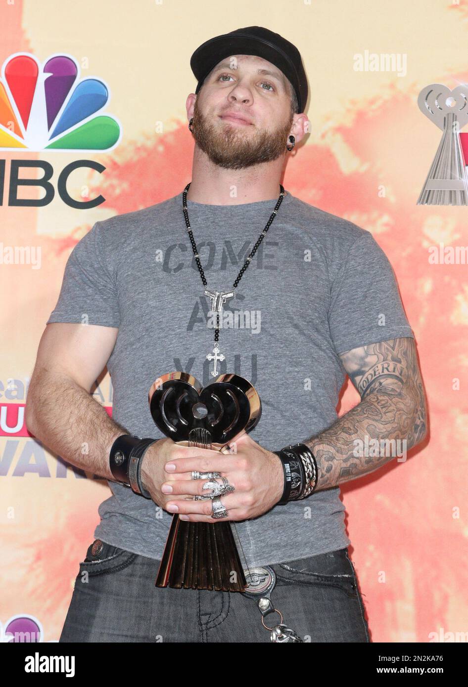 Brantley Gilbert poses in the press room with the renegade award at the ...