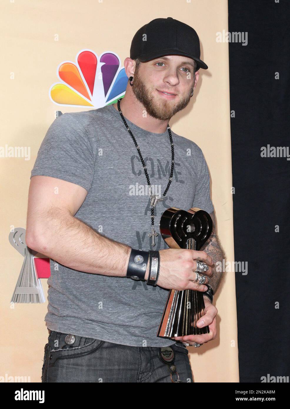 Brantley Gilbert poses in the press room with the renegade award at the ...