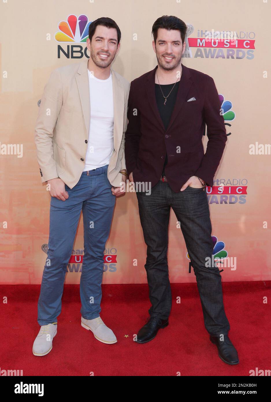 Drew Scott, left, and Jonathan Scott arrive at the iHeartRadio Music ...