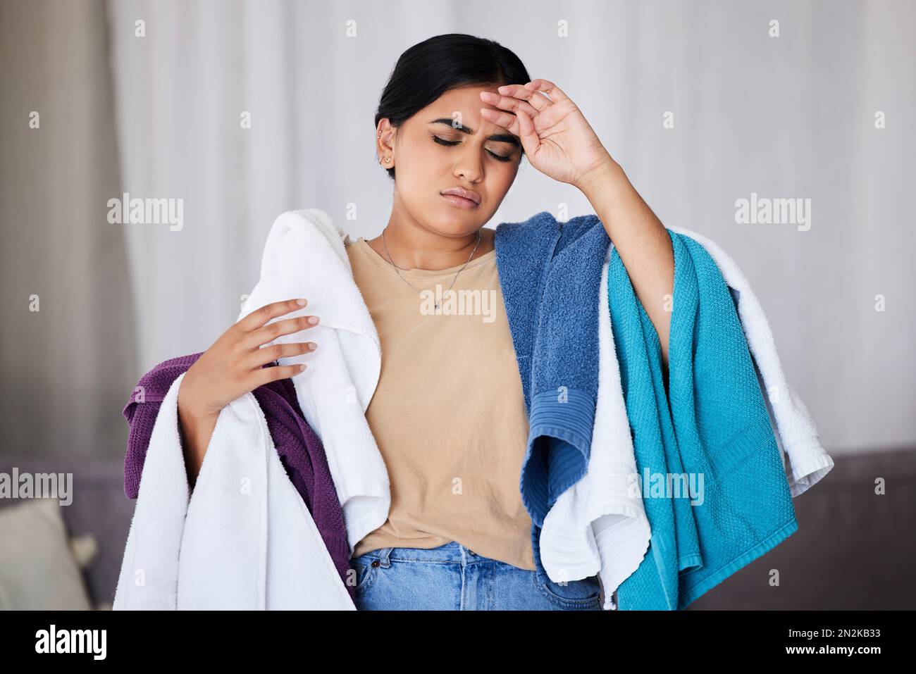 Tired cleaner, Indian woman and laundry work in a house with cleaning ...