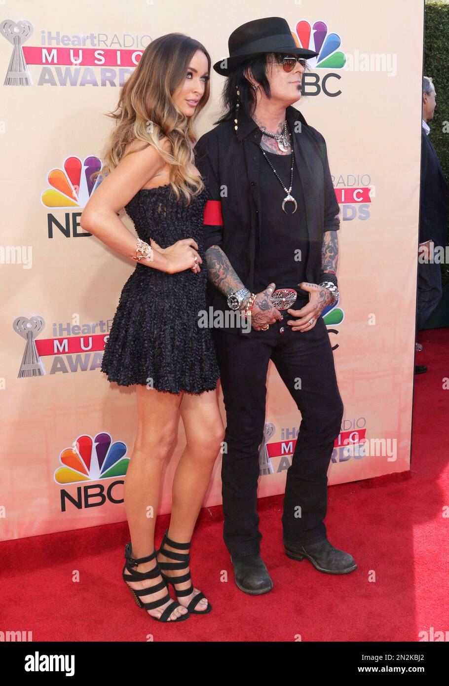 Niki Sixx, right, and Courtney Bingham arrive at the iHeartRadio Music ...