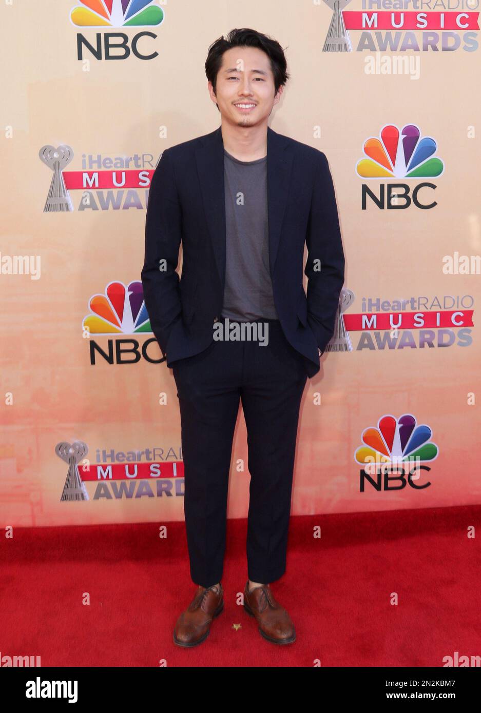 Steven Yeun arrives at the iHeartRadio Music Awards at The Shrine ...
