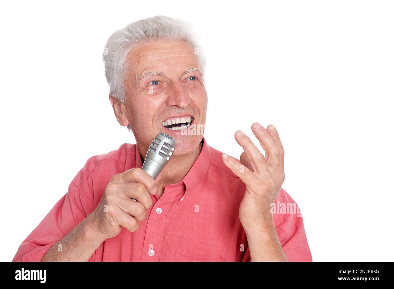 Senior man singing into microphone Stock Photo - Alamy