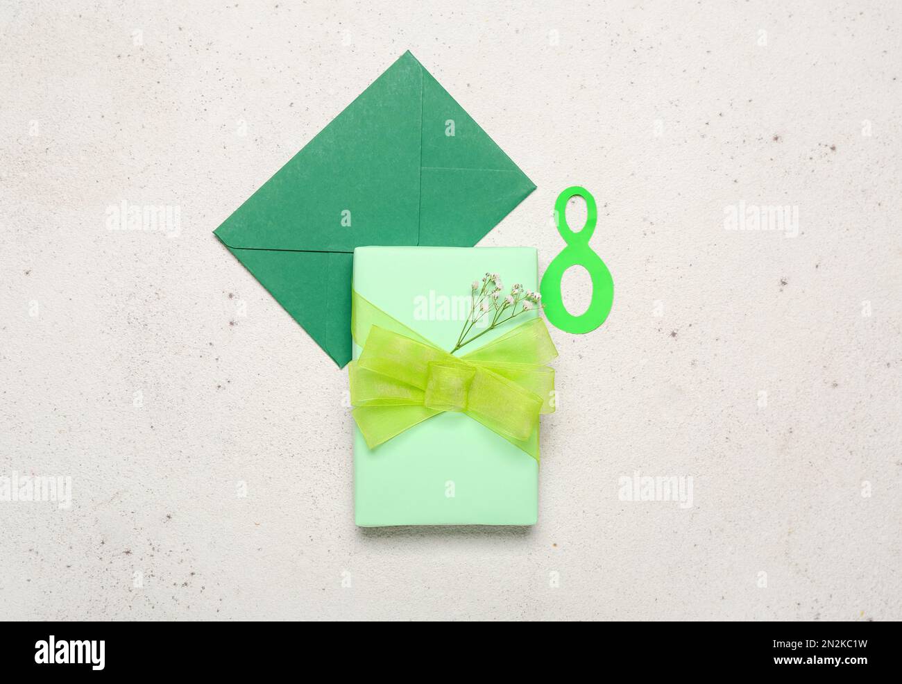 Number 8, envelope and gift for Women's Day celebration on white ...