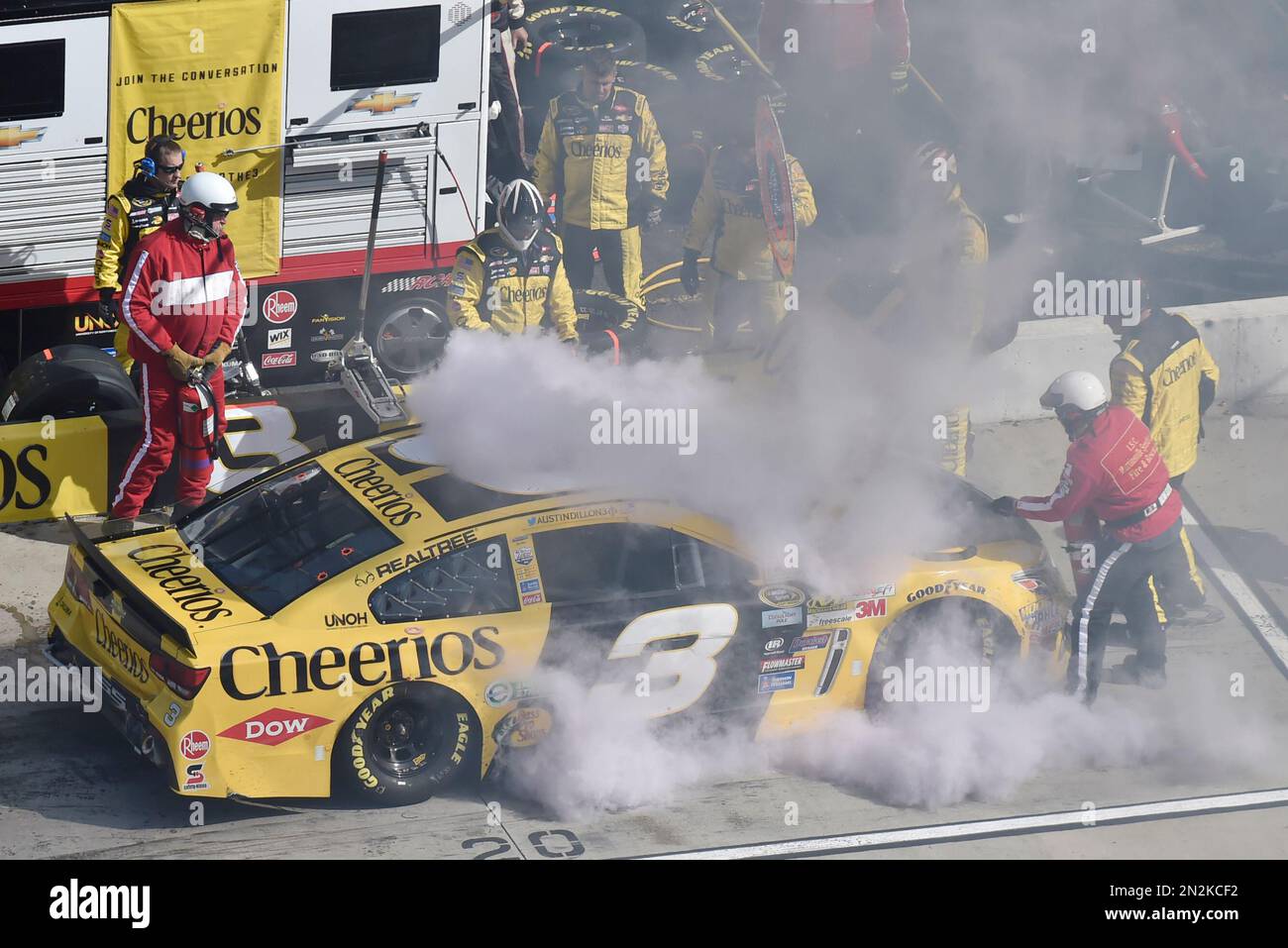 A firefighter uses an extinguisher on the car of Austin Dillon (3) in ...