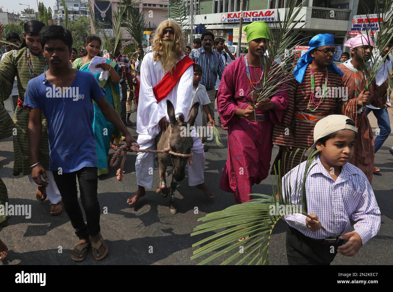 An Indian Christian devotee dressed like Jesus Christ sits on a donkey ...