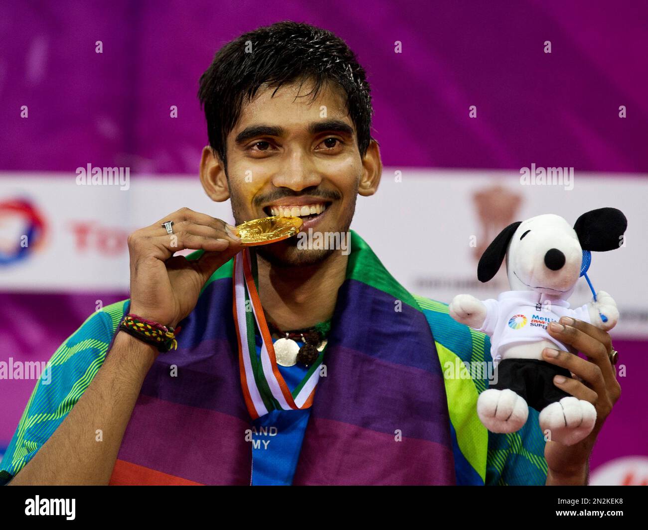 India's K. Srikanth displays his gold medal after winning against ...