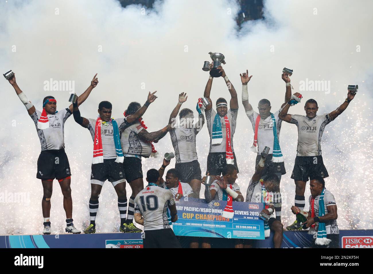 Fiji team members celebrate after winning the final match against New Zealand of the Hong Kong ...