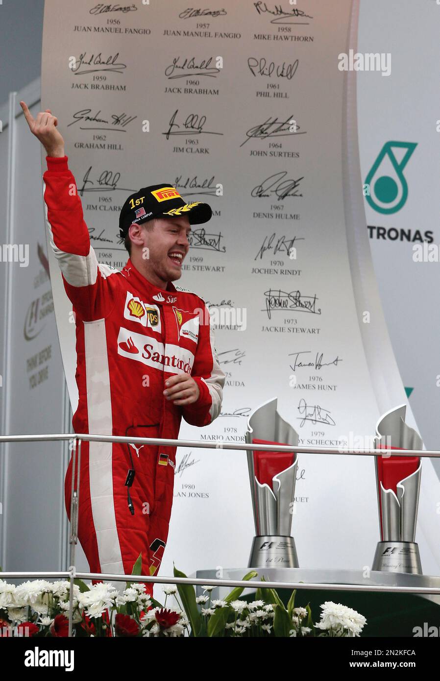 Ferrari driver Sebastian Vettel of Germany celebrates on the podium ...