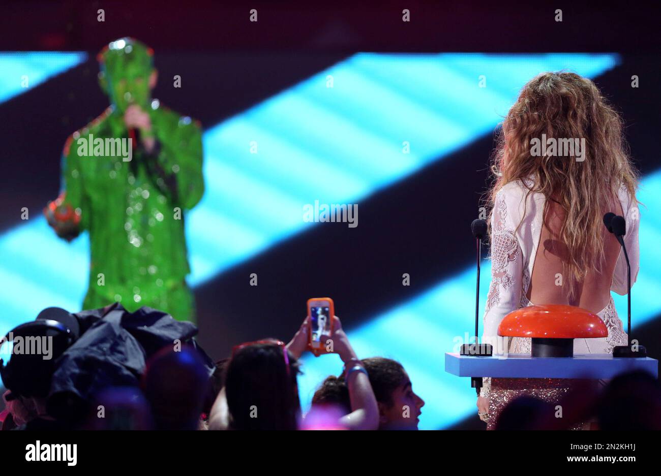 Nick Jonas gets slimed after he accepts the award for favorite male ...