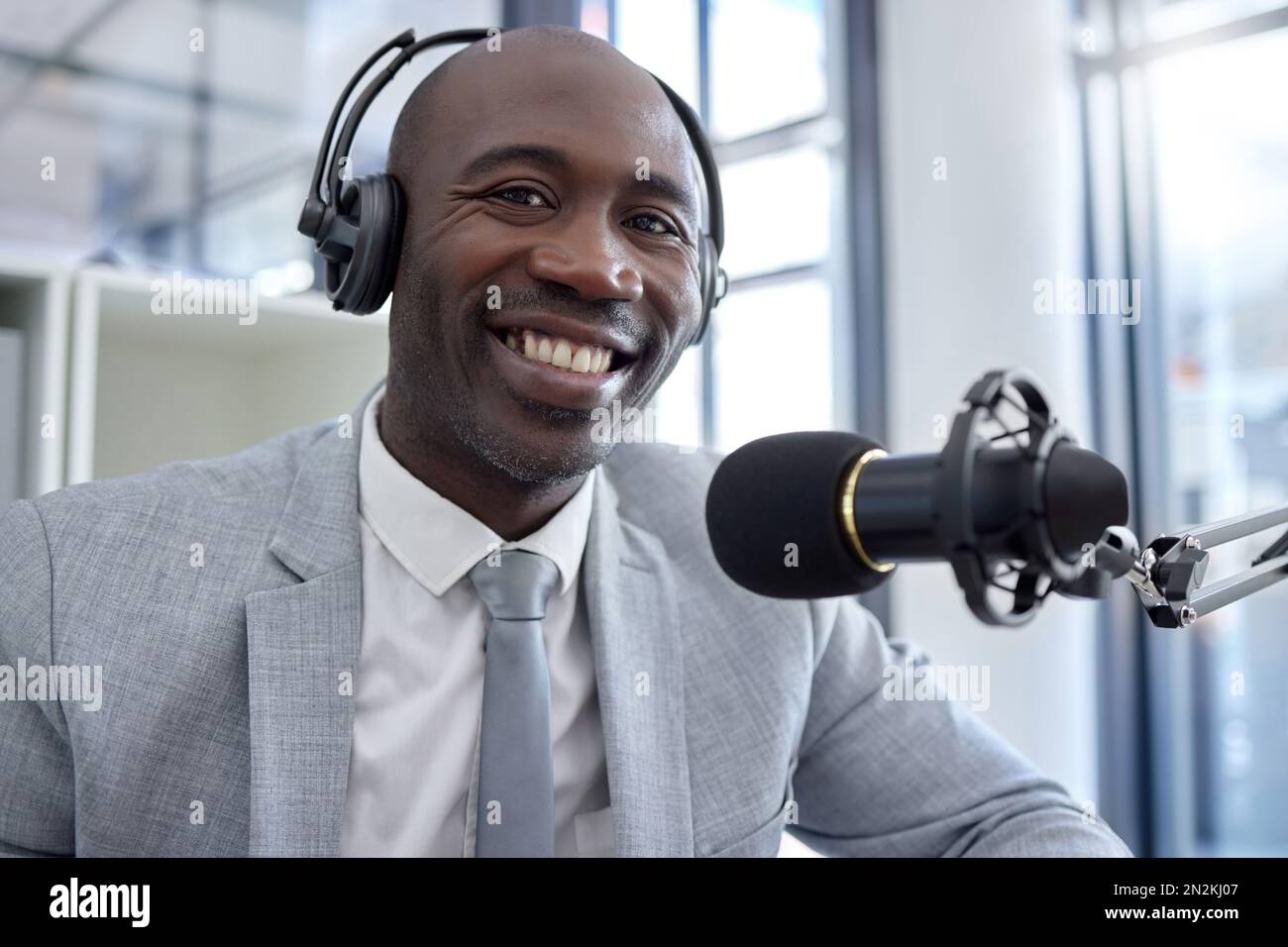 Radio, portrait and black man on microphone, professional podcast or ...