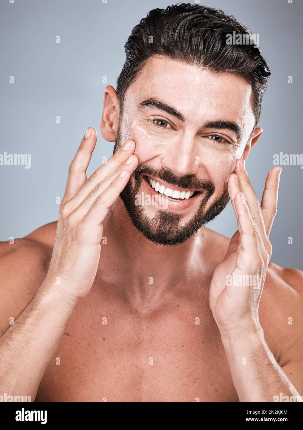 Portrait, skincare and man with cream in studio isolated on a gray background for facial ...