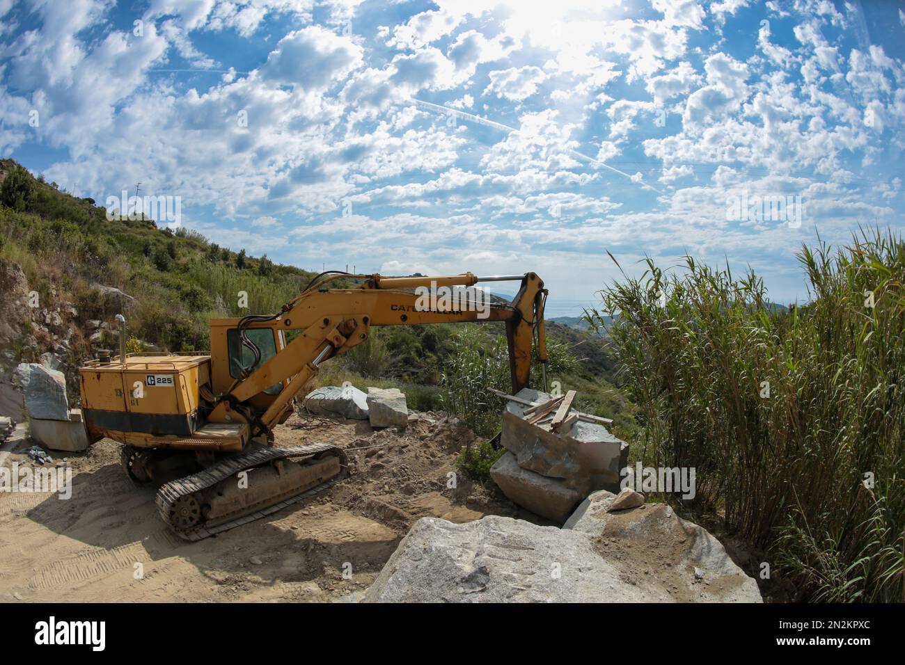 Processing of marble in the quarry. Crane for excavating marble in the ...