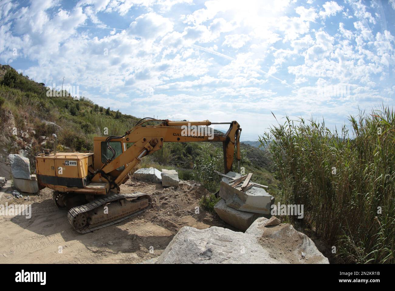 Processing of marble in the quarry. Crane for excavating marble in the ...