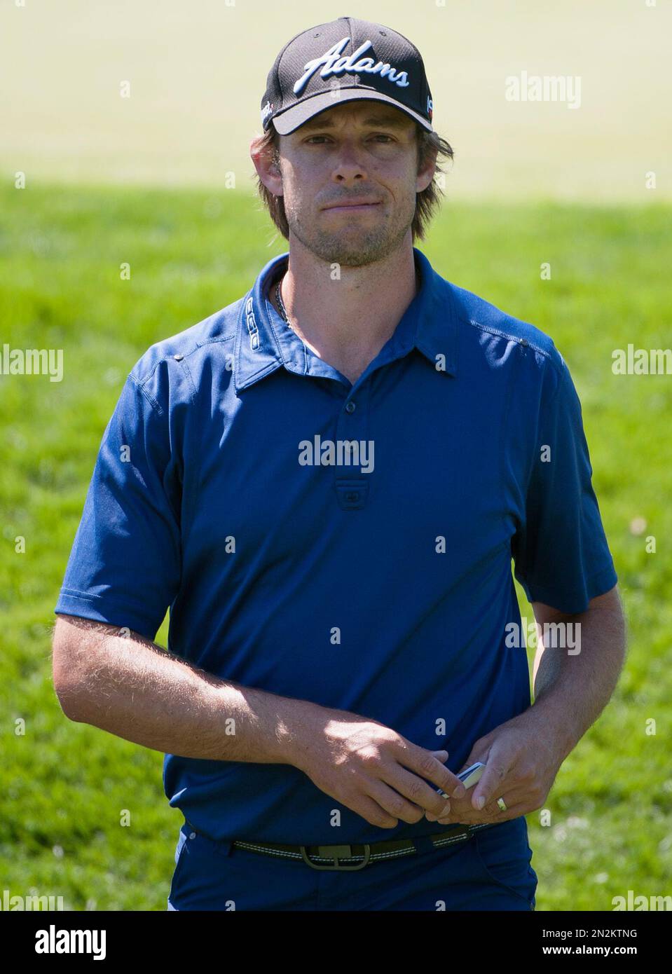 Aaron Baddeley, of Australia, walks off the ninth green during the ...