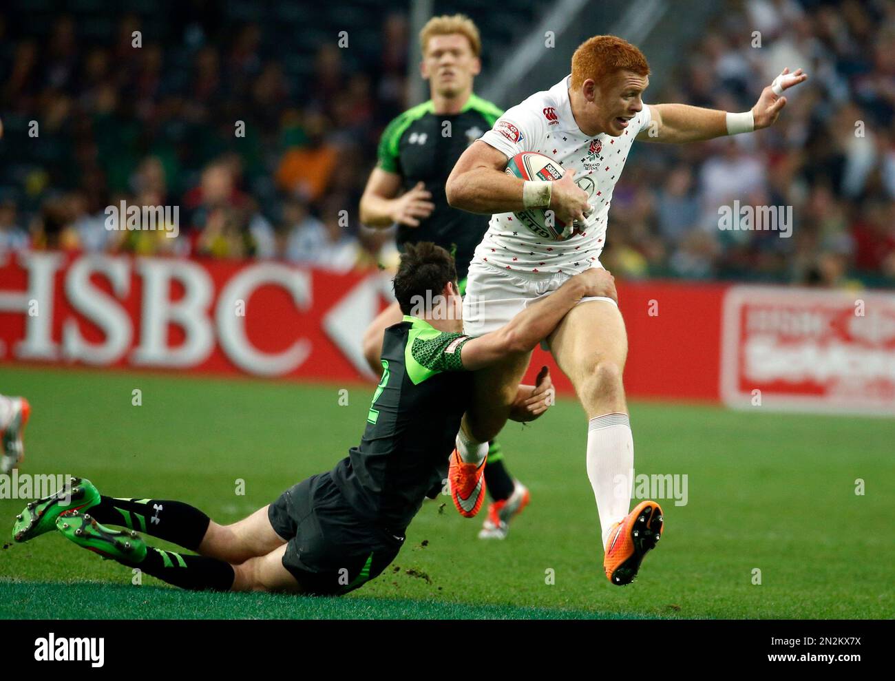 England's James Rodwell, right, is tackled by Tomos Williams, of Wales ...