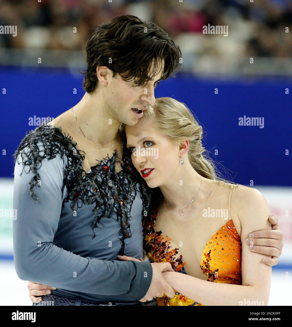 Kaitlyn Weaver and Andrew Poje of Canada finish their performance in the Ice Dance Free Dance ...