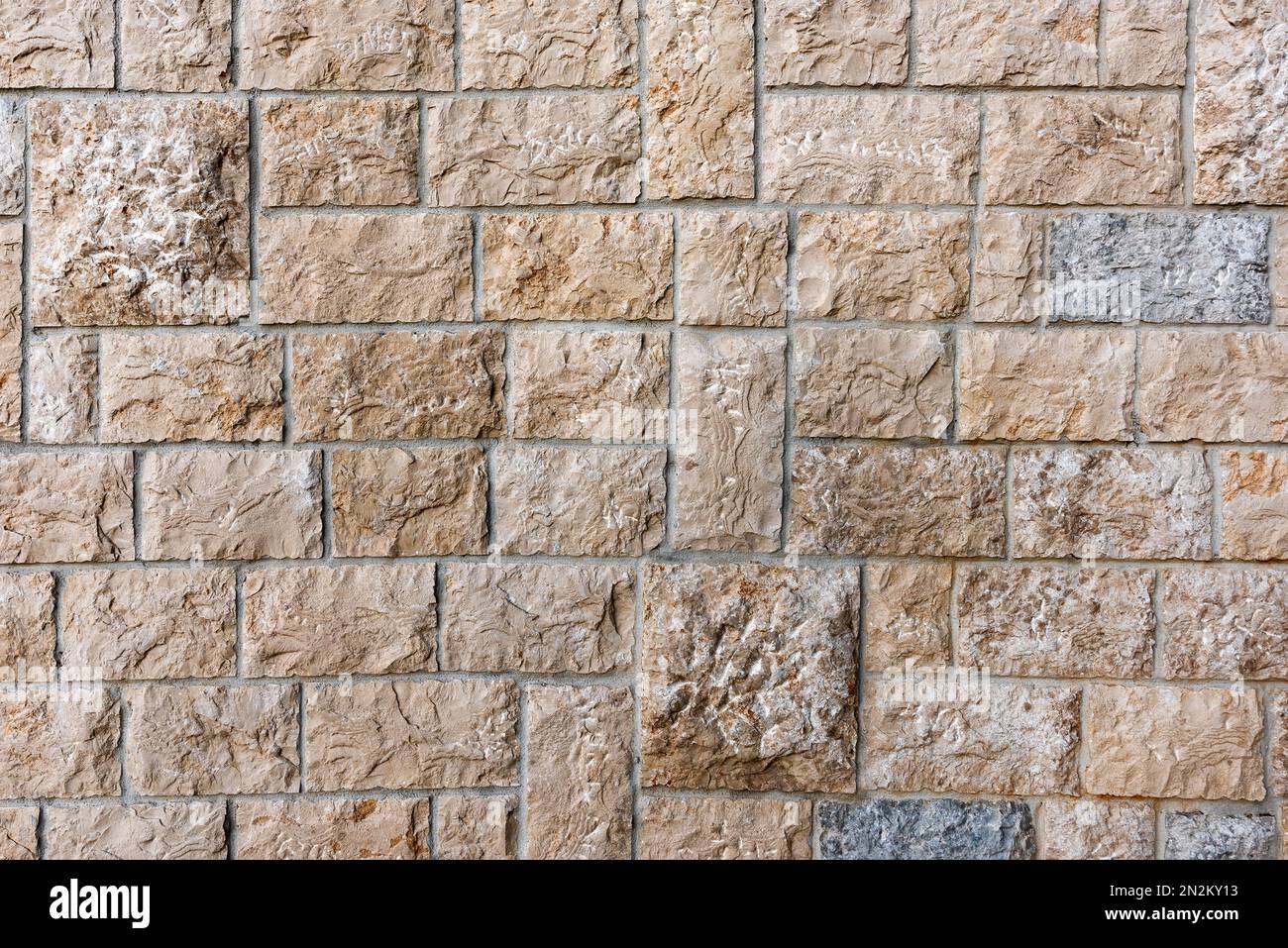 Stone tiled facade wall of a building as background Stock Photo - Alamy