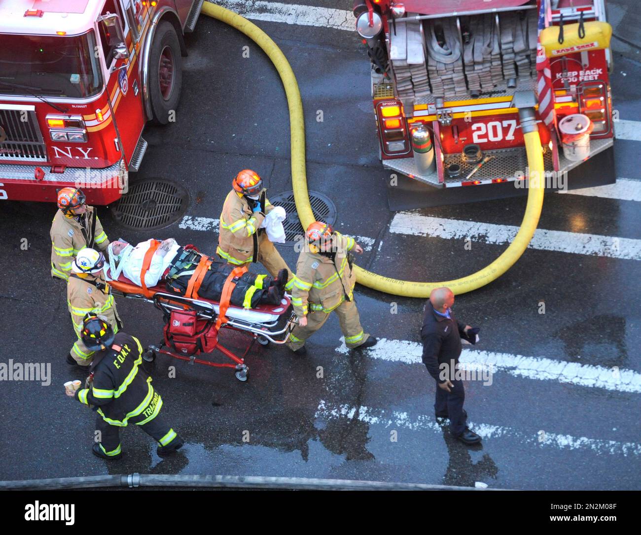 CORRECTS YEAR TO 2015 FROM 2014 - Firefighters carry an an injured ...