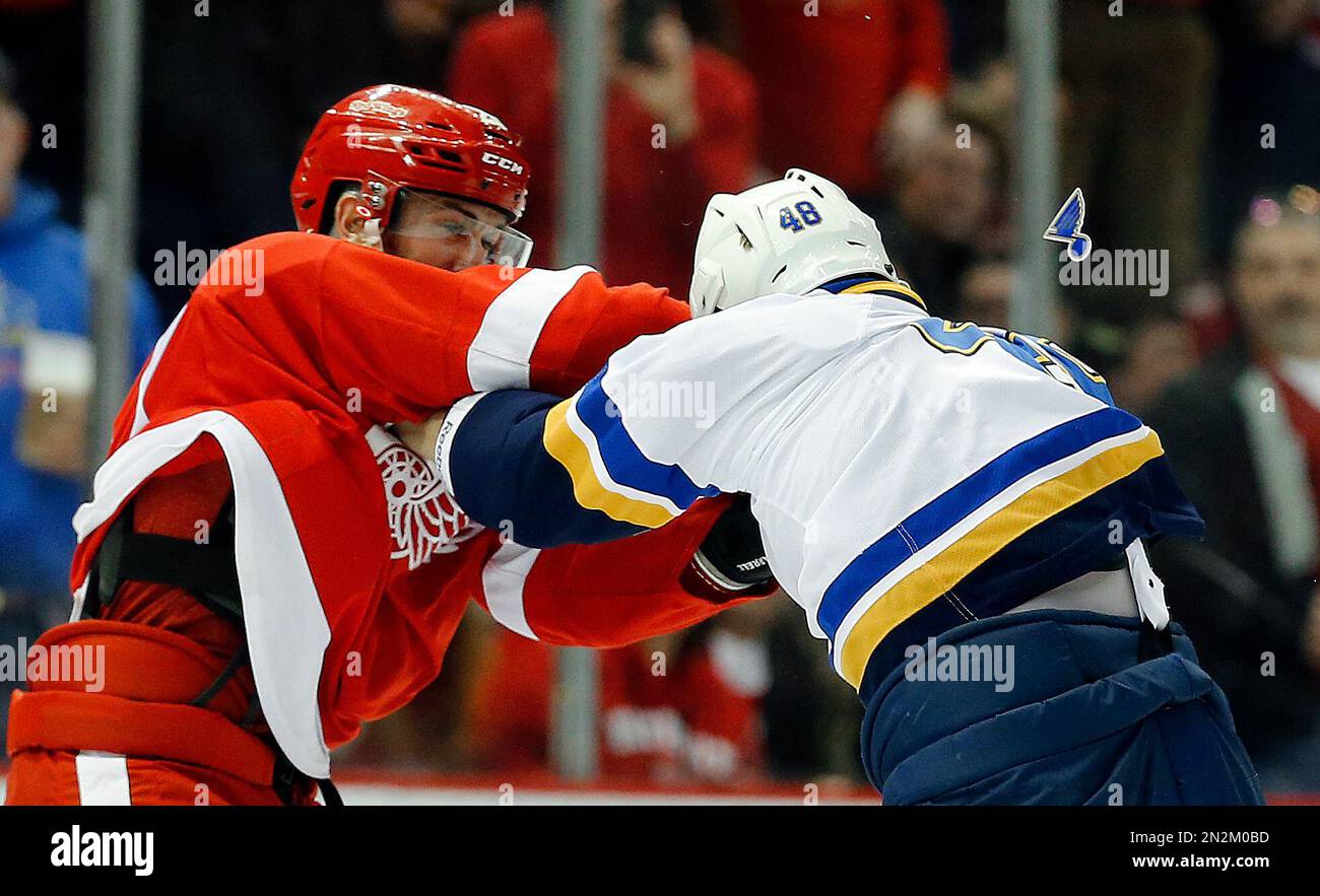 Detroit Red Wings left wing Drew Miller (20) knocks a sticker from St ...