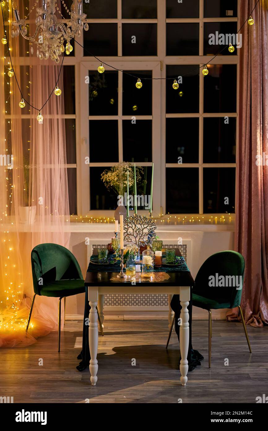Romantic dinner table setting for couple with festive lights, Table for ...