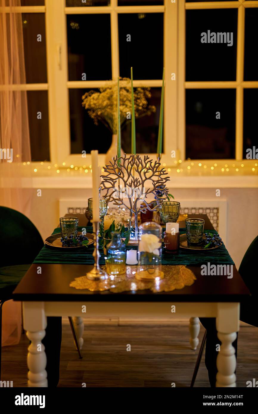 Romantic dinner table setting for couple with festive lights, Table for ...