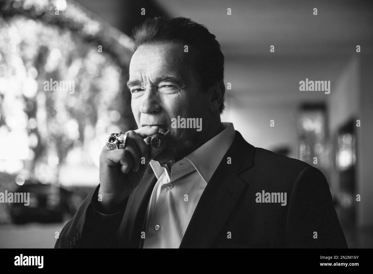 Arnold Schwarzenegger smokes a cigar during press day for "Terminator ...