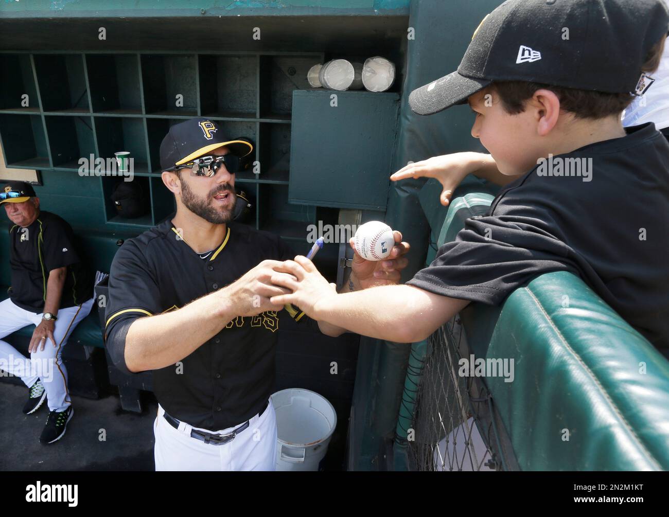 Pittsburgh Pirates right fielder Andrew Lambo signs a ball for Andrew ...