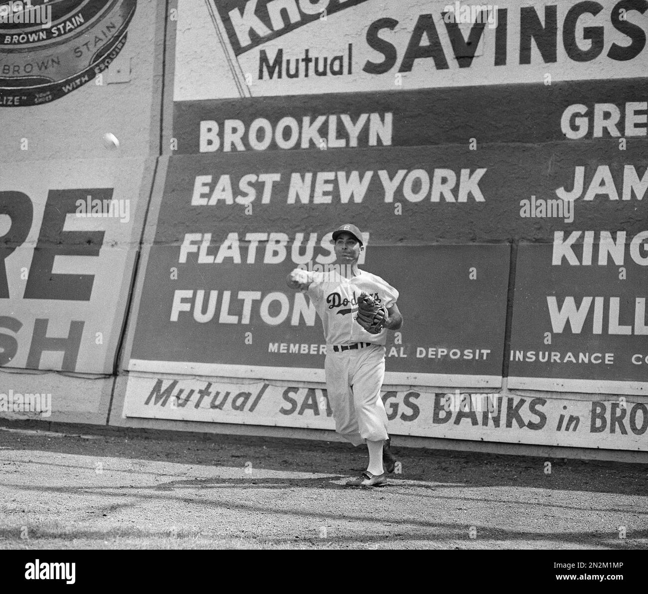 Outfielder Carl Furillo demonstrates why he is the master of the right ...