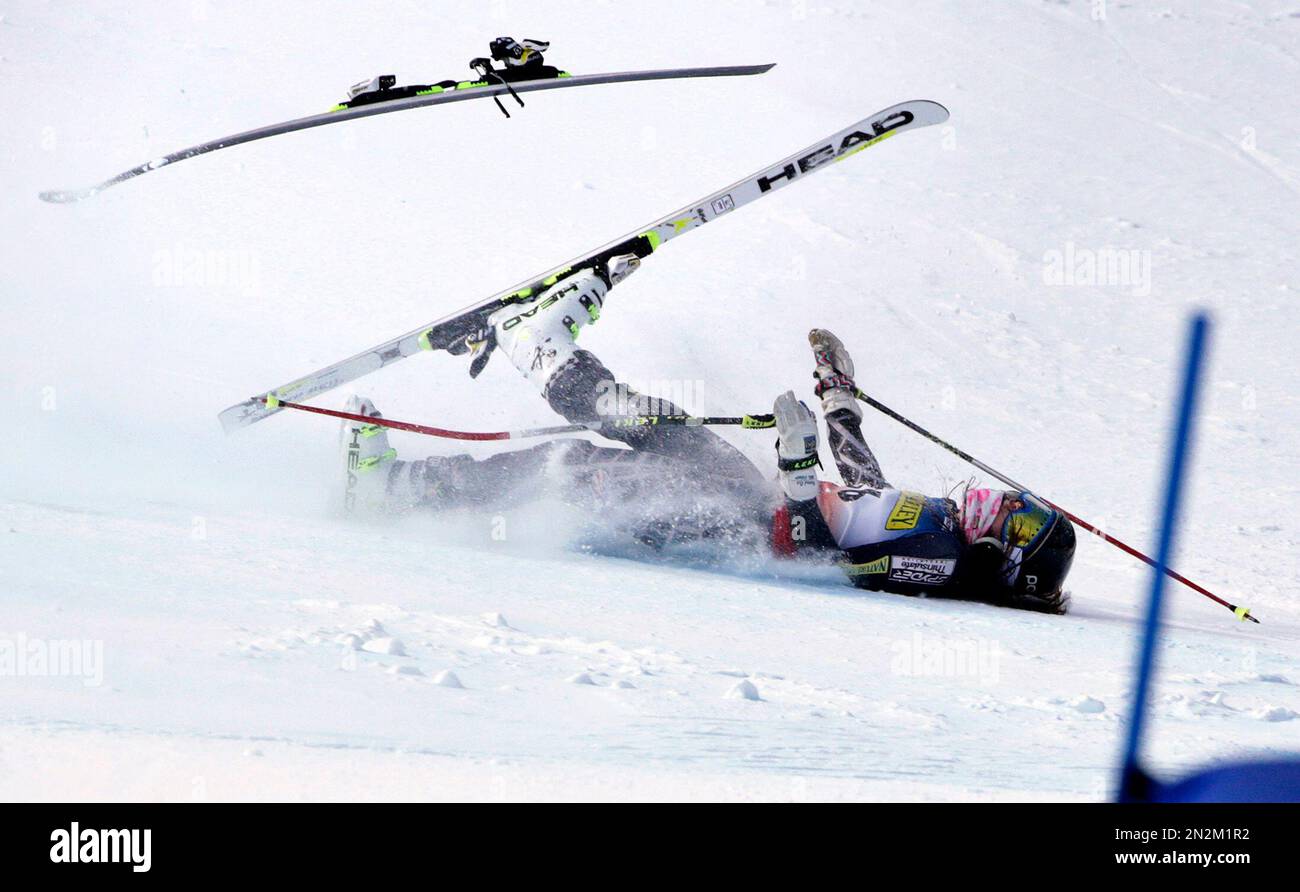 Kate Hanson, of Rochester, Minn., loses a ski as she crashes during the ...