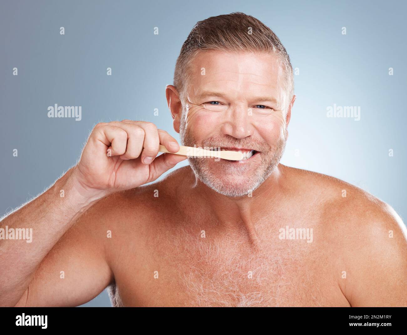 Portrait, cleaning or old man brushing teeth with dental toothpaste for healthy oral hygiene ...