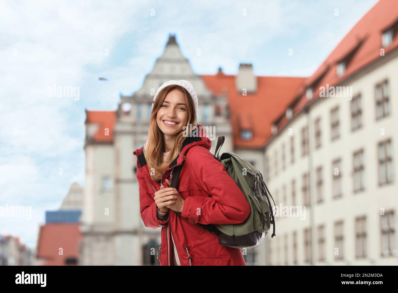 Happy traveler with backpack in foreign city during vacation Stock ...