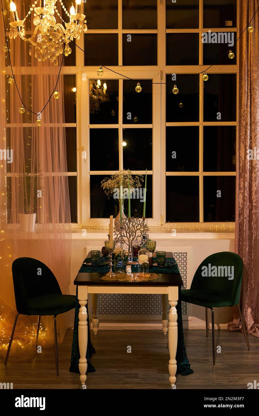 Romantic dinner table setting for couple with festive lights, Table for ...