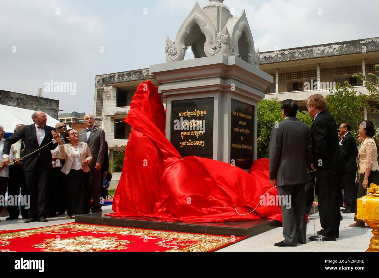 German Ambassador to Cambodia, Joachim Baron Von Marschall, left, pulls ...