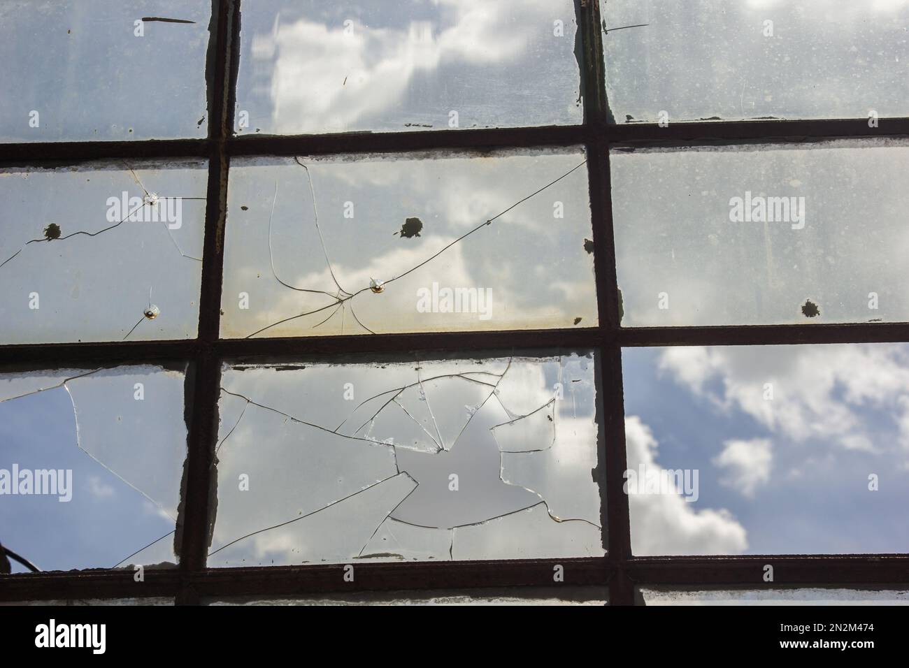 broken glass in the window. background sky, danger, devastation Stock ...