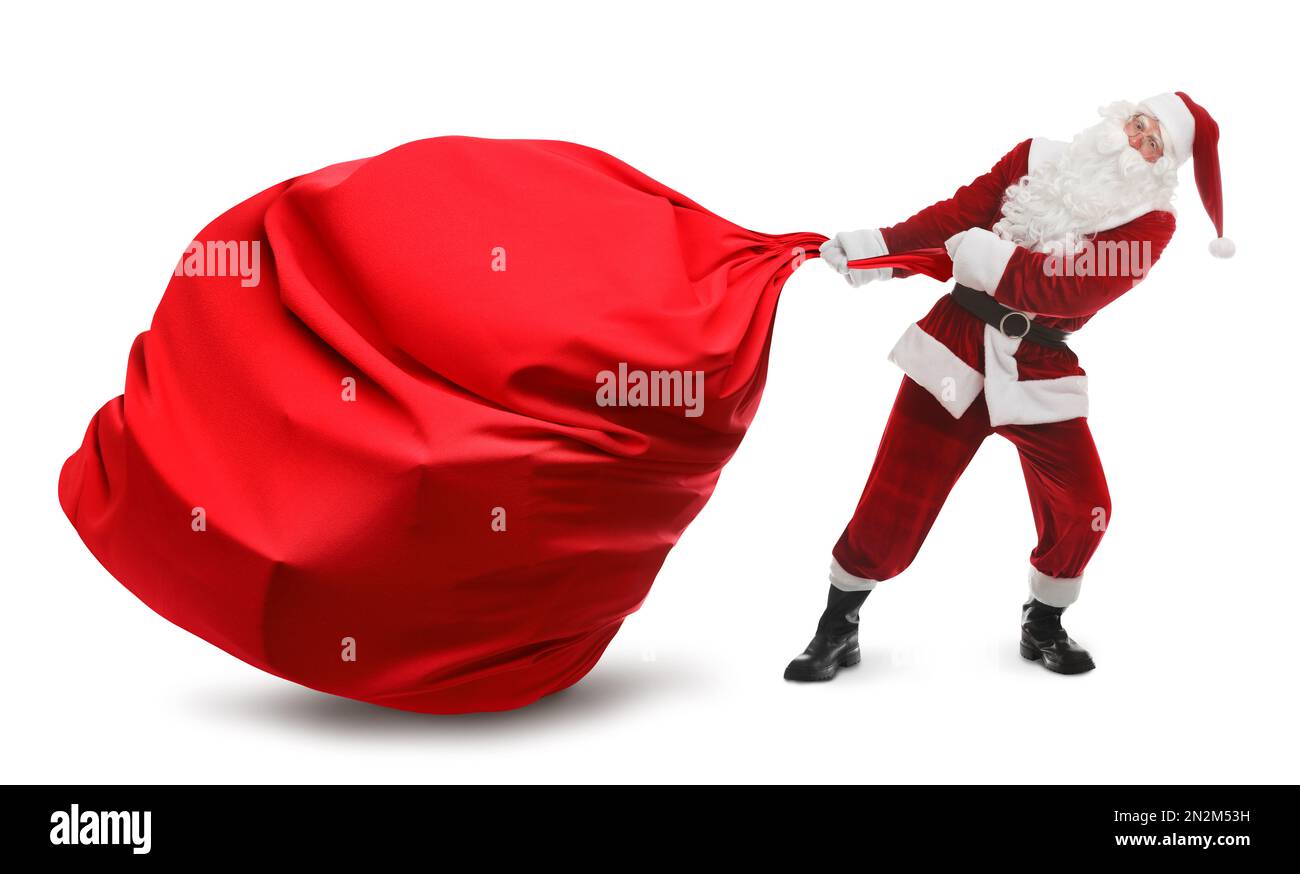 Santa Claus pulling enormous red bag full of Christmas gifts on white ...