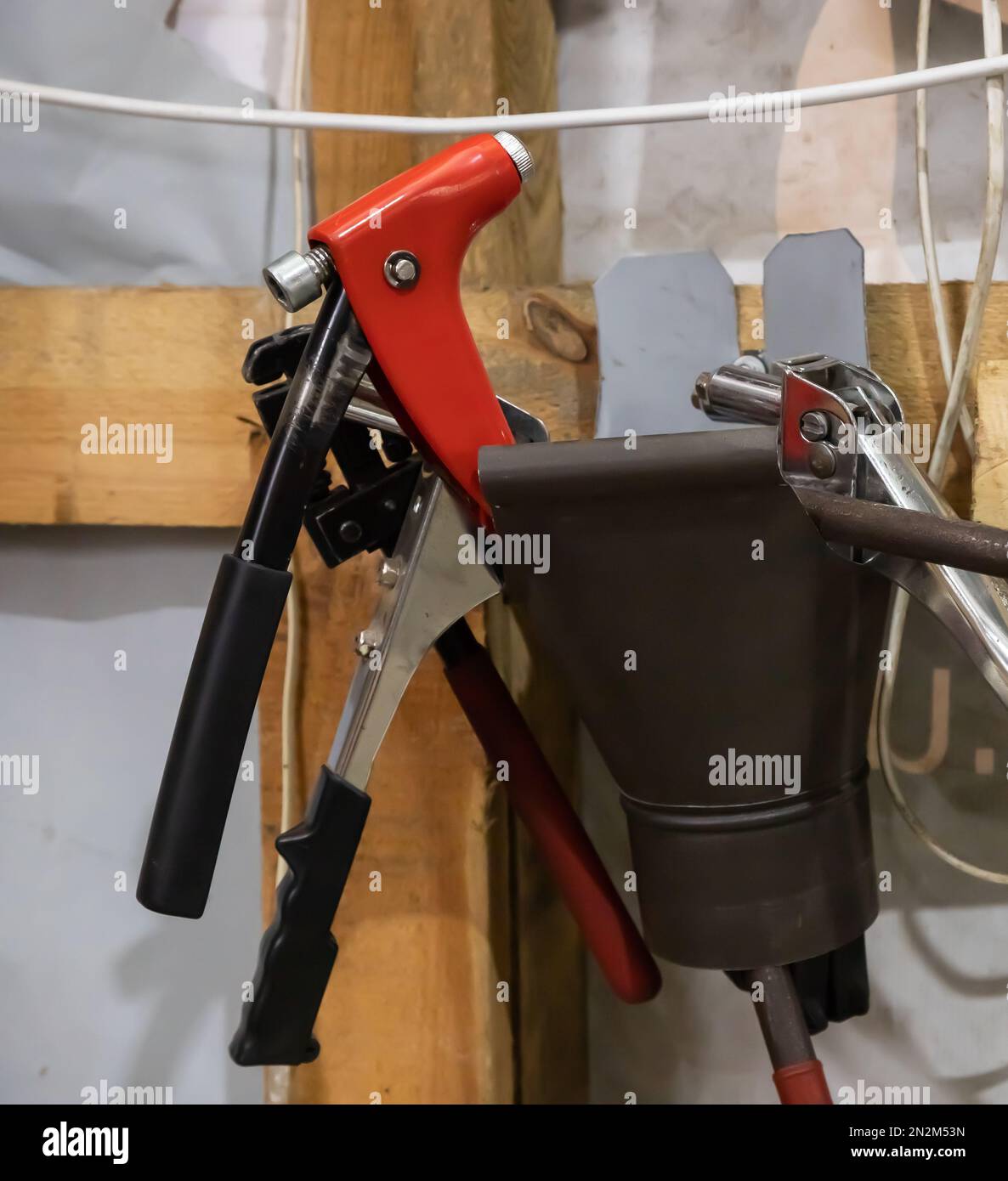 tools in the workshop drills, screwdrivers, scissors on the metal, on ...