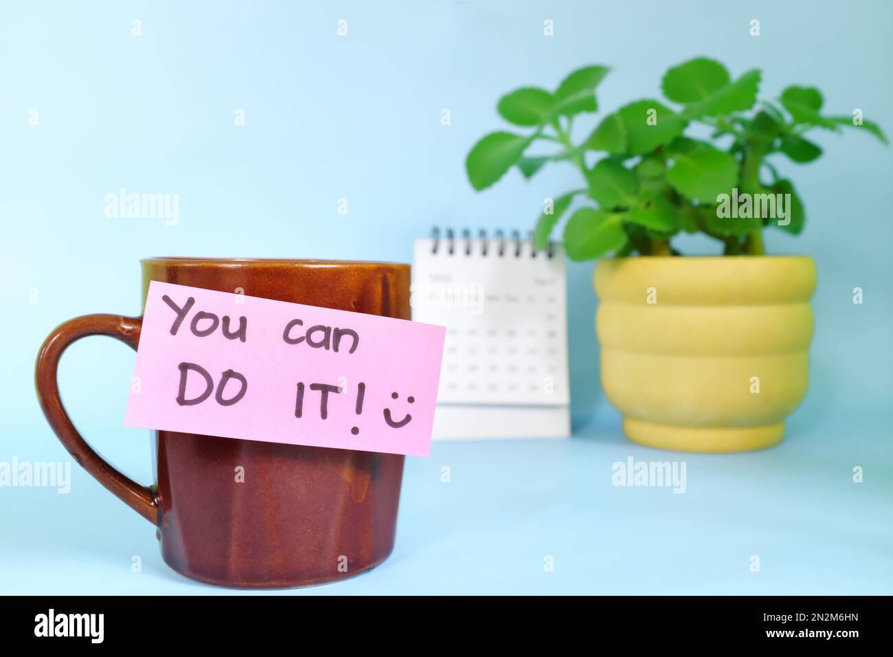 You can do it words of encouragement concept. Selective focus of a cup ...