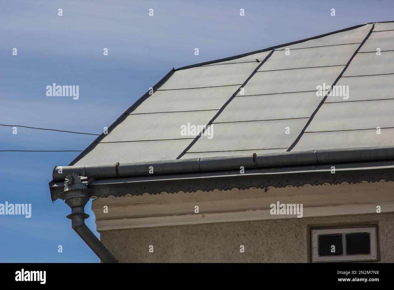 Roofing materials of a roof of the house a metal tile Stock Photo - Alamy