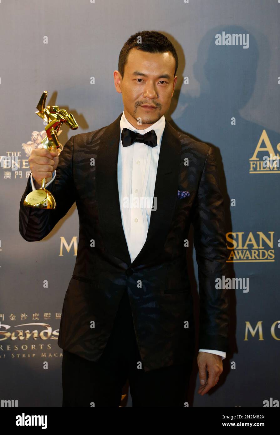 Chinese actor Liao Fan poses after winning the Best Actor award for his ...