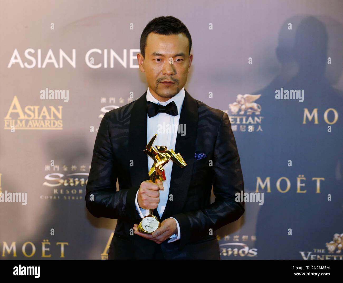 Chinese actor Liao Fan poses after winning the Best Actor award for his ...