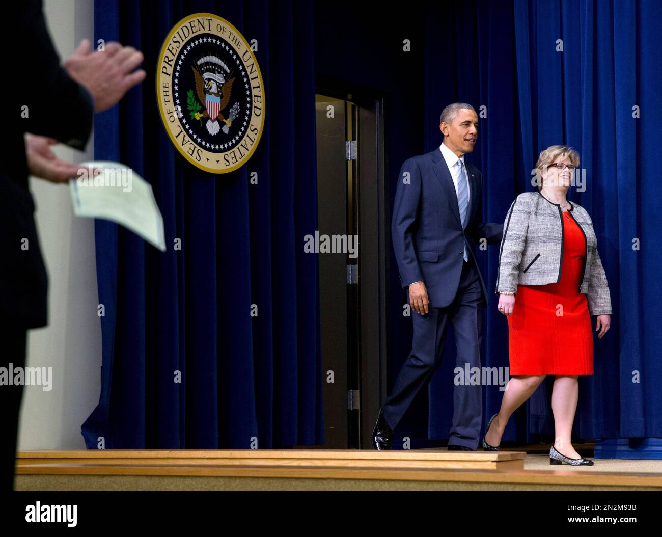 President Barack Obama walks on stage with Nancy Beran, Westchester ...