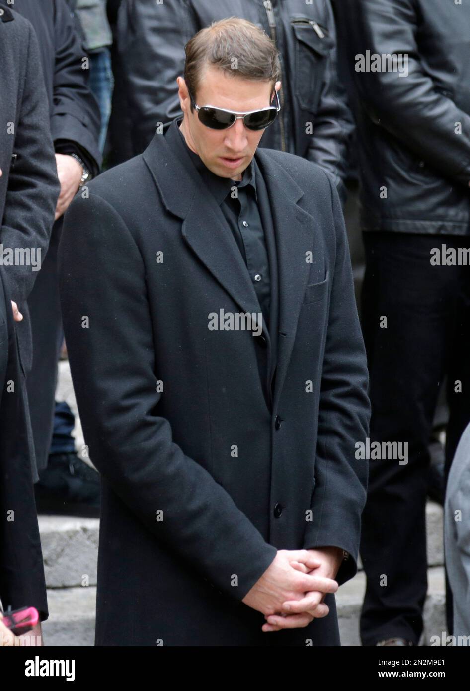 French swimmer Alain Bernard leaves the church after attending the ...